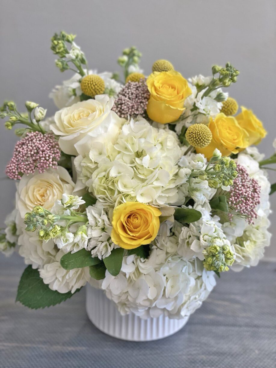 Triumph Floral Arrangement: White and Yellow Roses with Hydrangeas